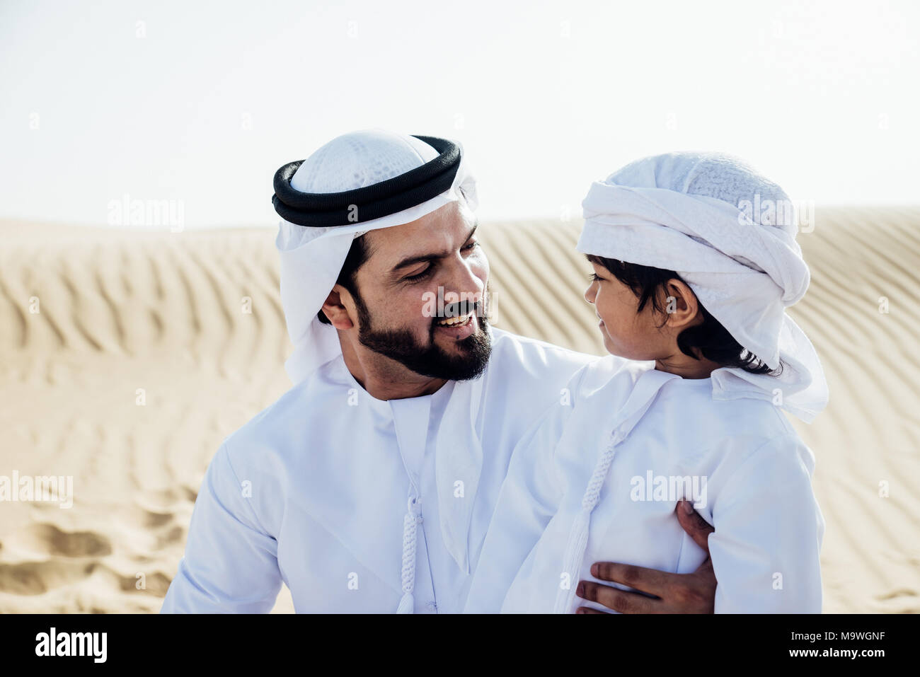 Father and son spending time in the desert Stock Photo - Alamy