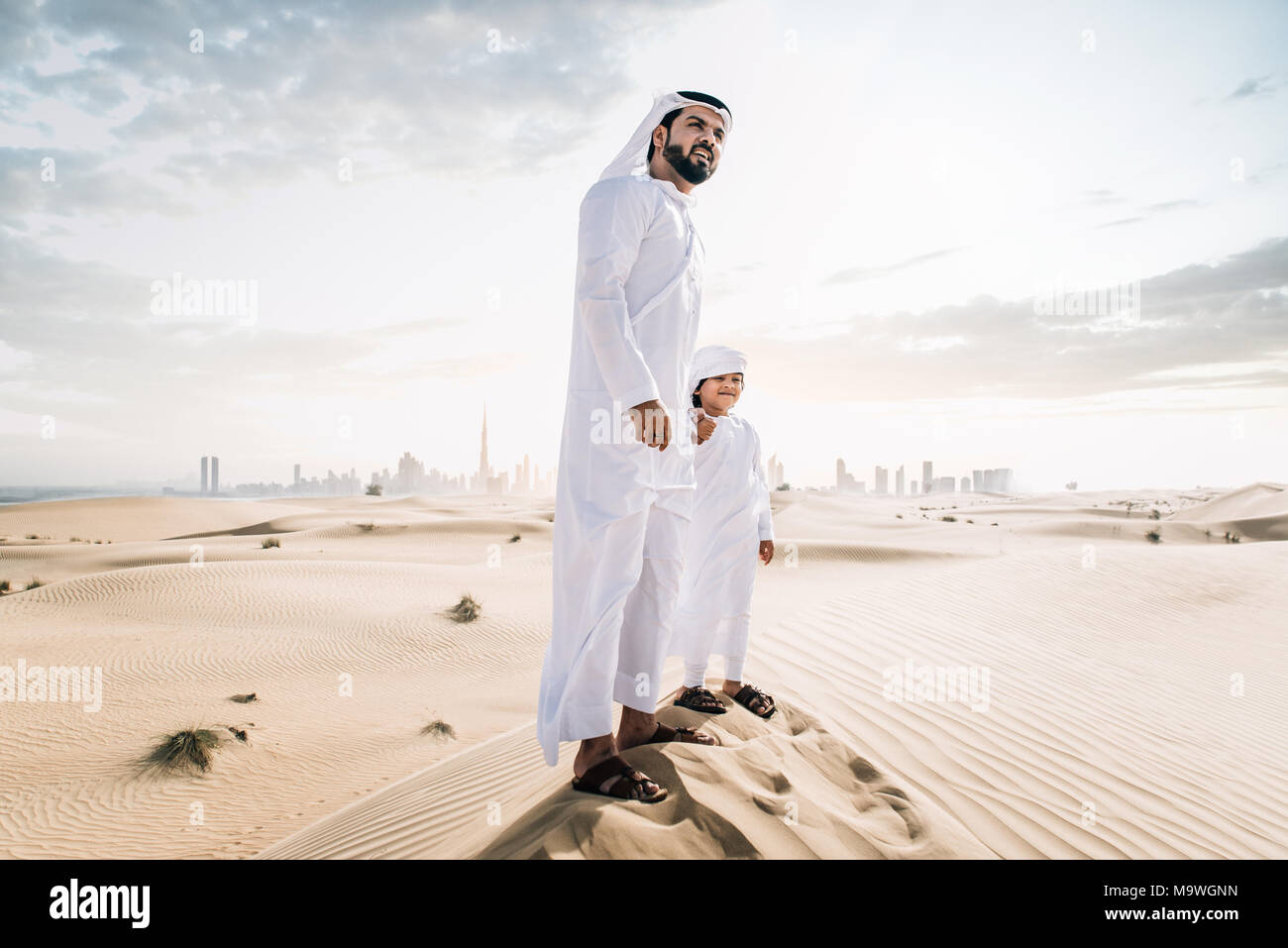 Father and son spending time in the desert Stock Photo - Alamy
