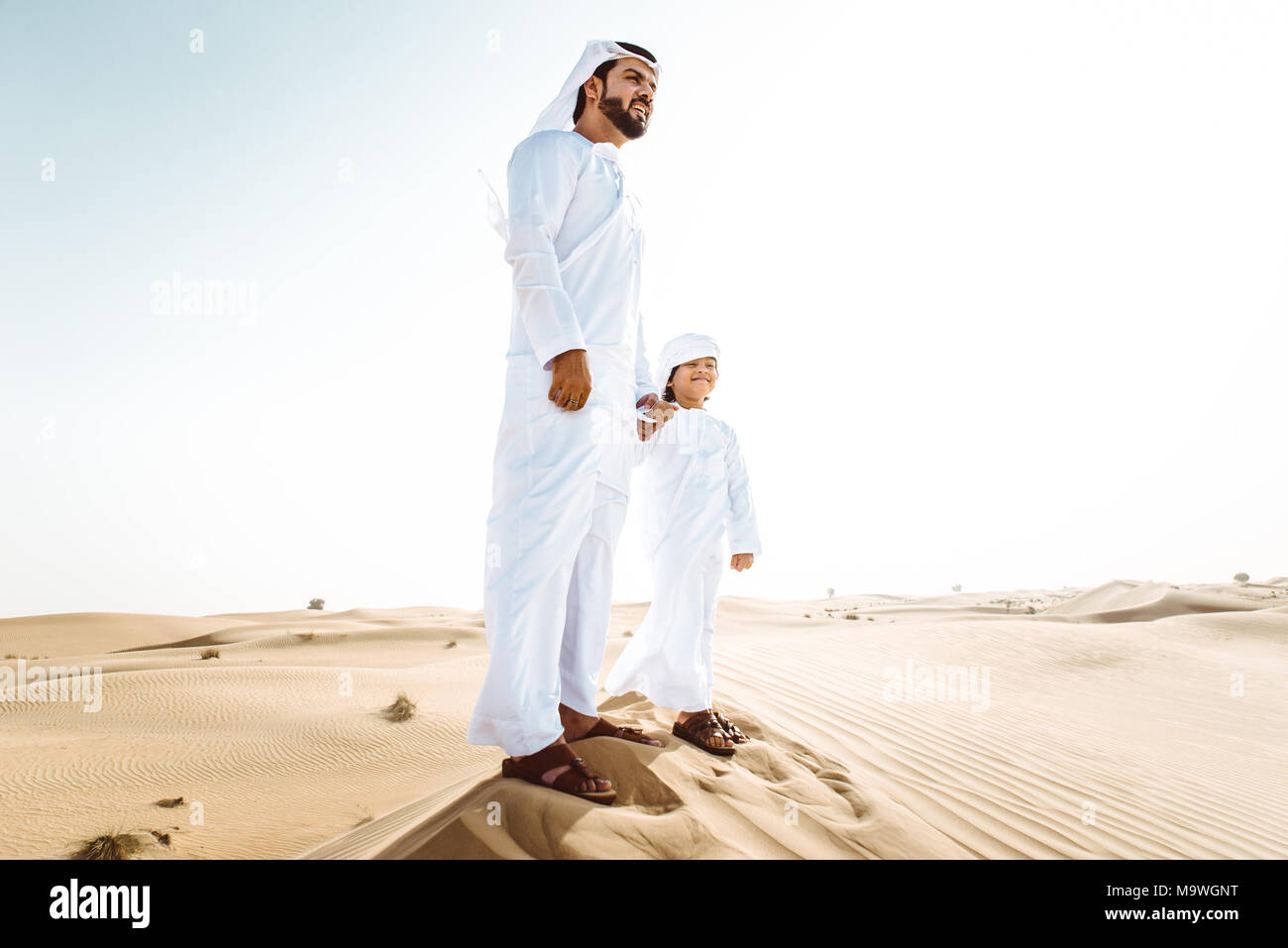 Father and son spending time in the desert Stock Photo - Alamy