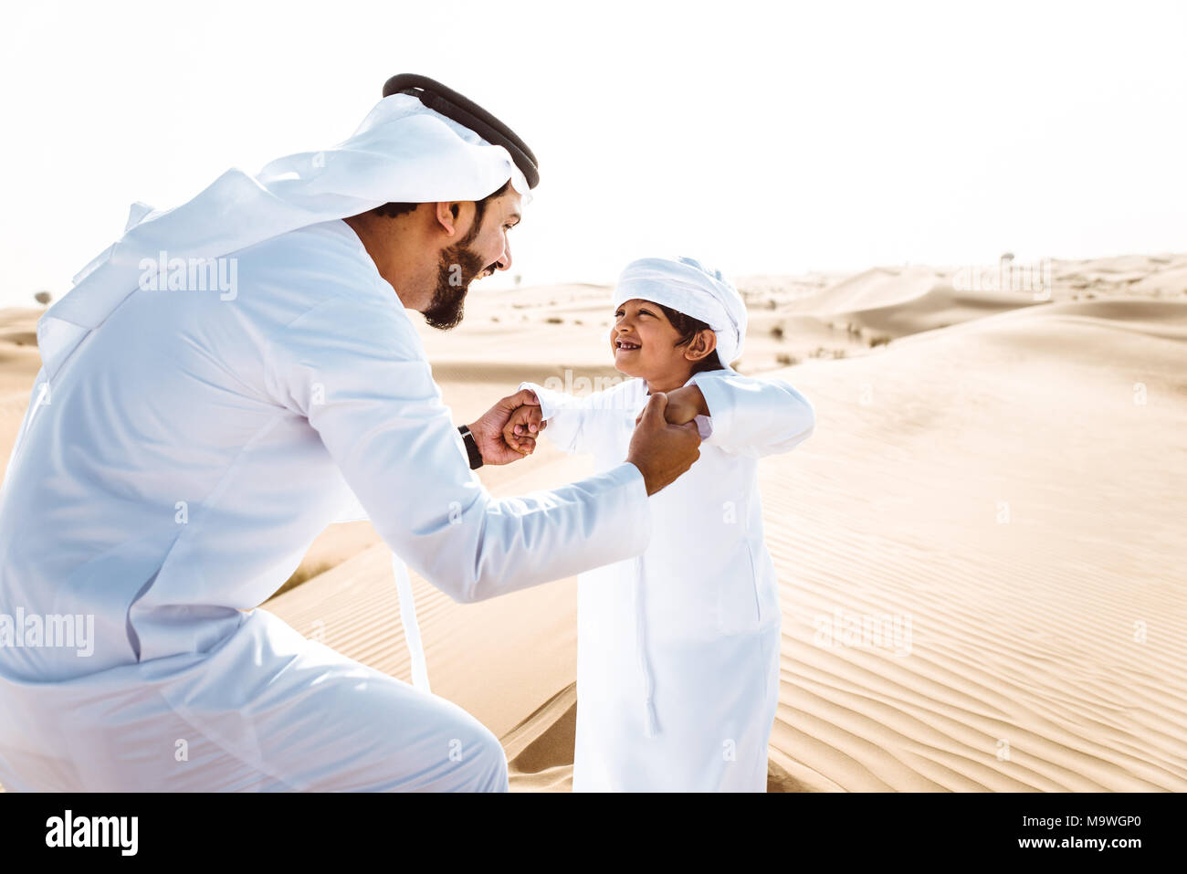 Father and son spending time in the desert Stock Photo - Alamy