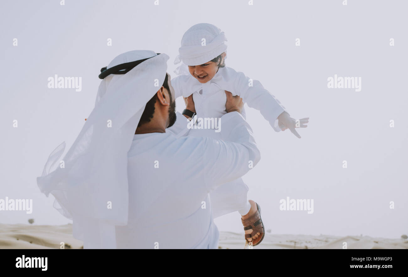 Father and son spending time in the desert Stock Photo - Alamy