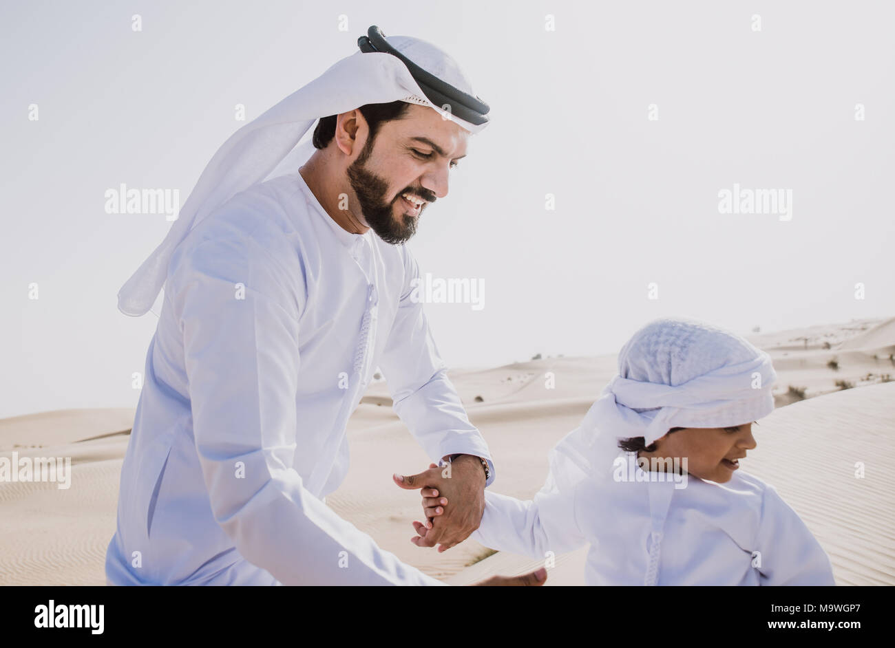 Father and son spending time in the desert Stock Photo - Alamy