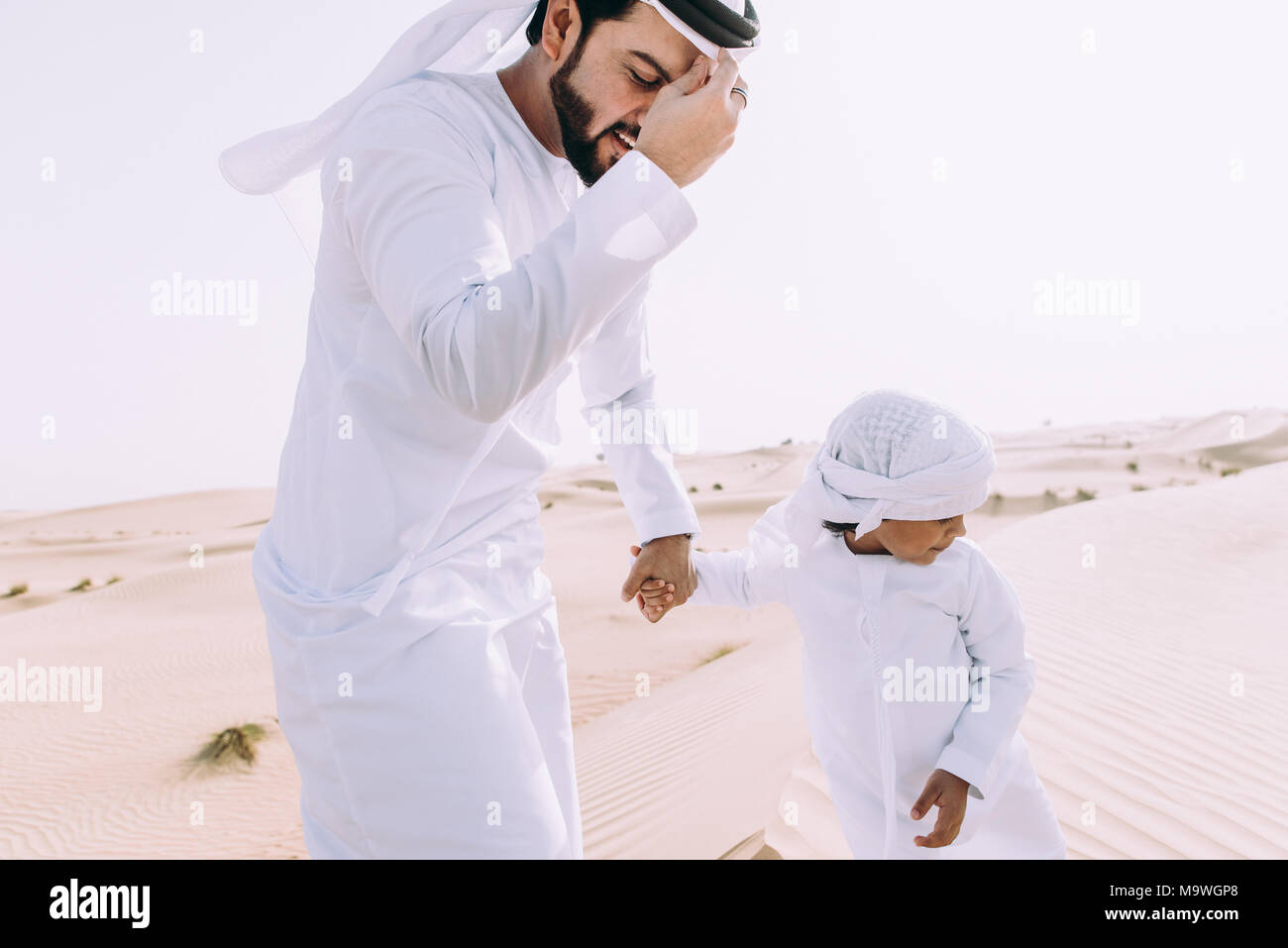 Father and son spending time in the desert Stock Photo - Alamy