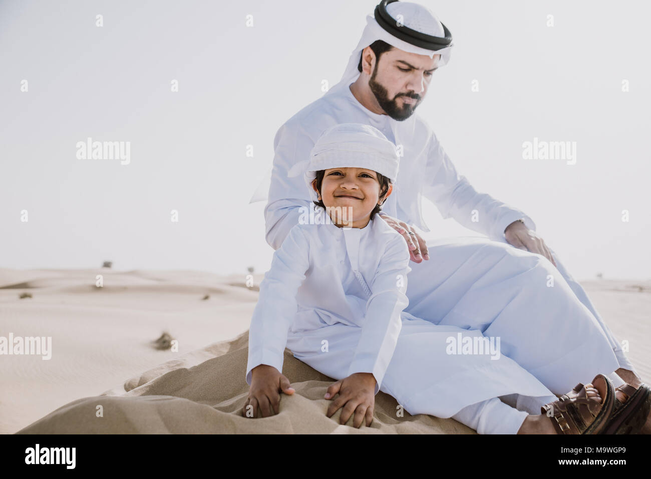 Father and son spending time in the desert Stock Photo - Alamy