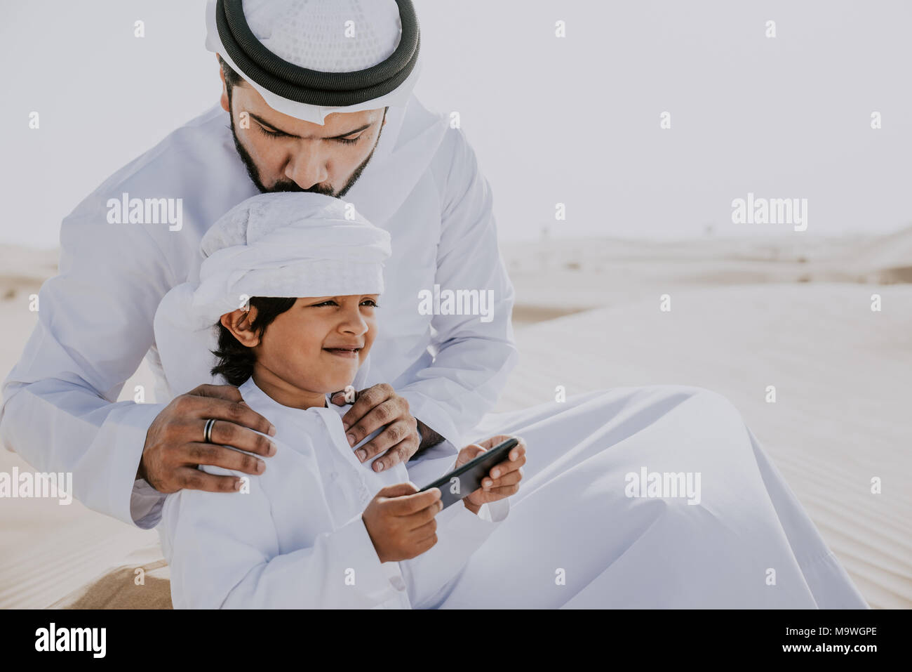 Father and son spending time in the desert Stock Photo - Alamy