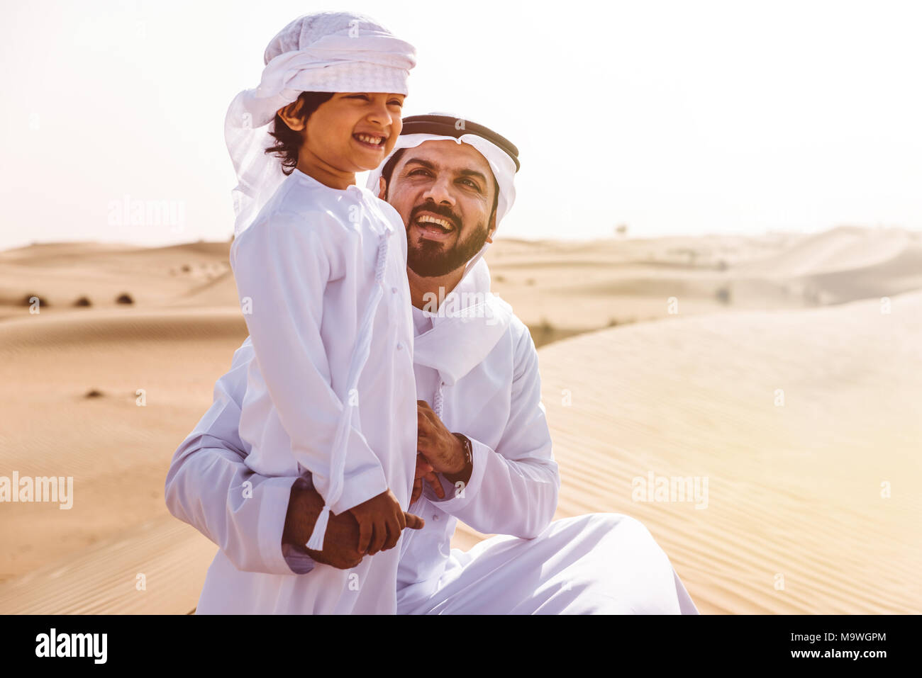 Father and son spending time in the desert Stock Photo - Alamy