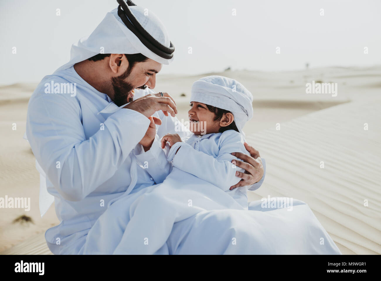 Father and son spending time in the desert Stock Photo - Alamy
