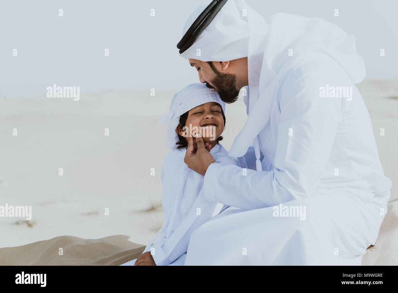Father and son spending time in the desert Stock Photo - Alamy