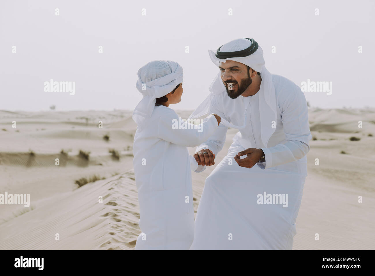 Father and son spending time in the desert Stock Photo - Alamy