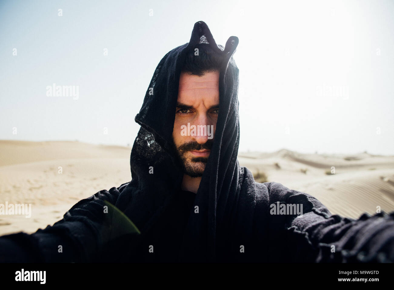 Man exploring the desert Stock Photo - Alamy