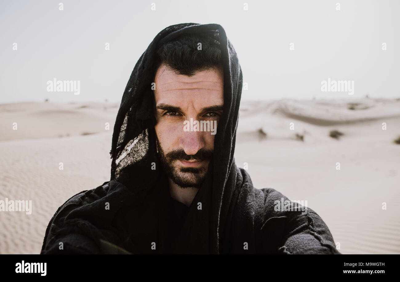 Man exploring the desert Stock Photo - Alamy