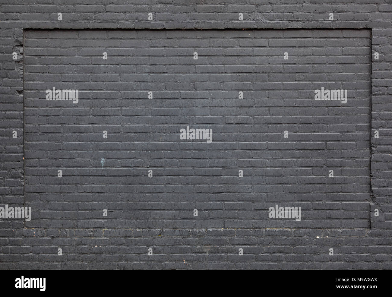 background consisting of part of anthracite brick wall Stock Photo - Alamy