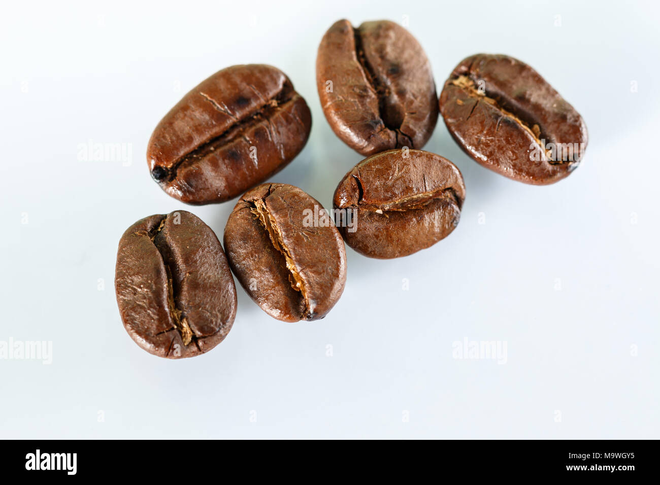 Four coffee beans hi-res stock photography and images - Alamy
