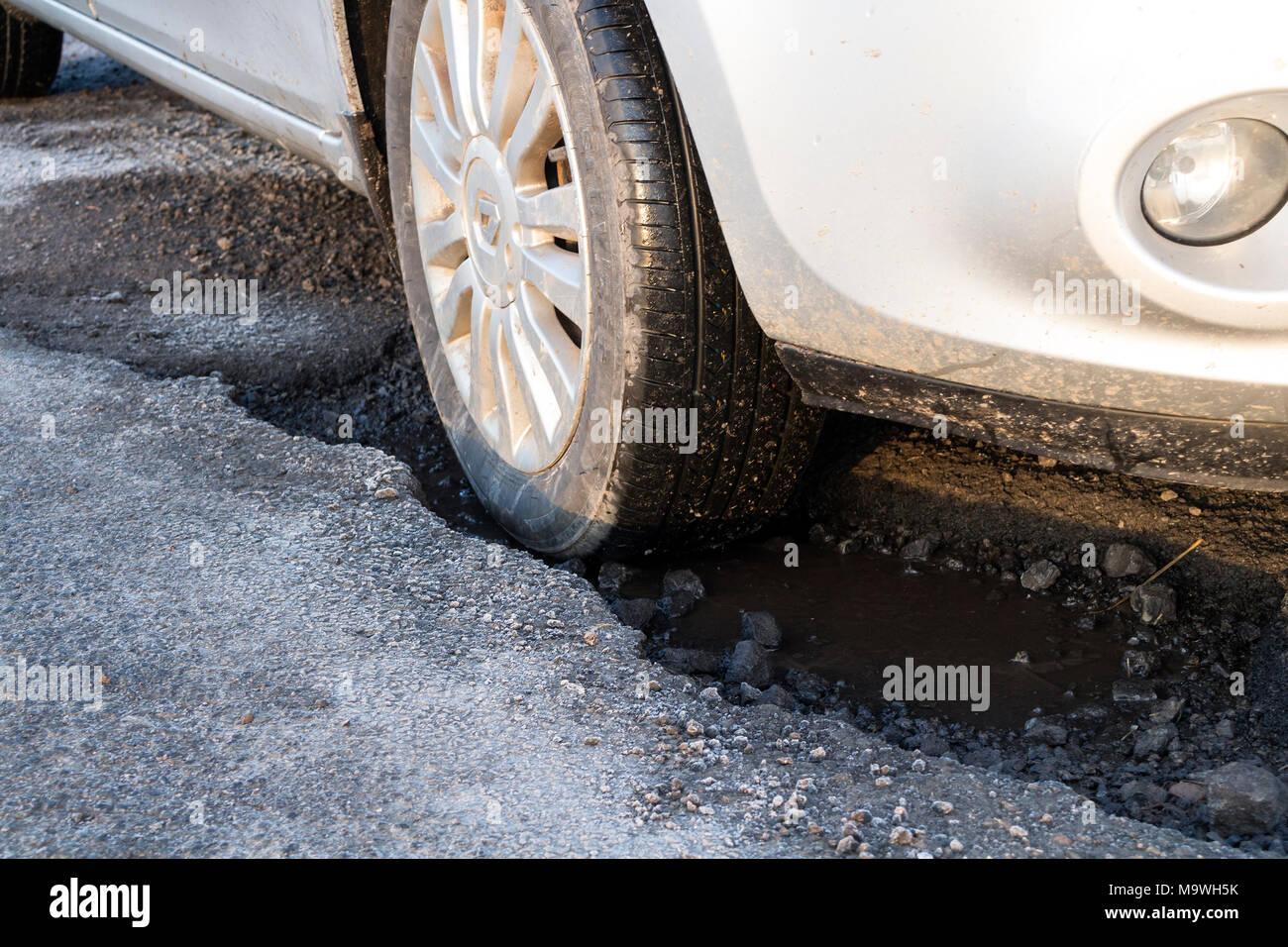 Pothole car hi-res stock photography and images - Alamy