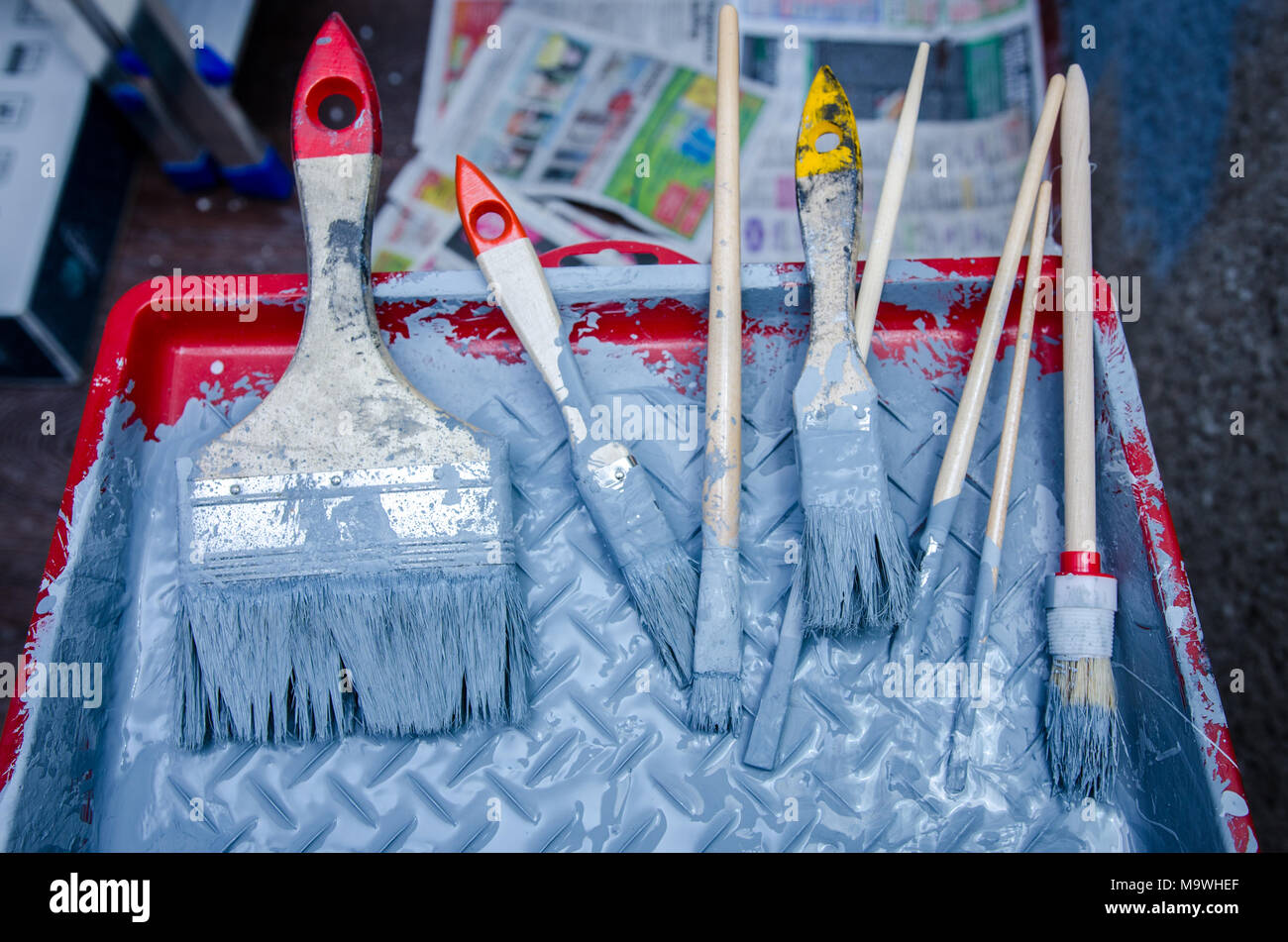 Set of painter tools. House renovation tools. Old used brushes and blue ...