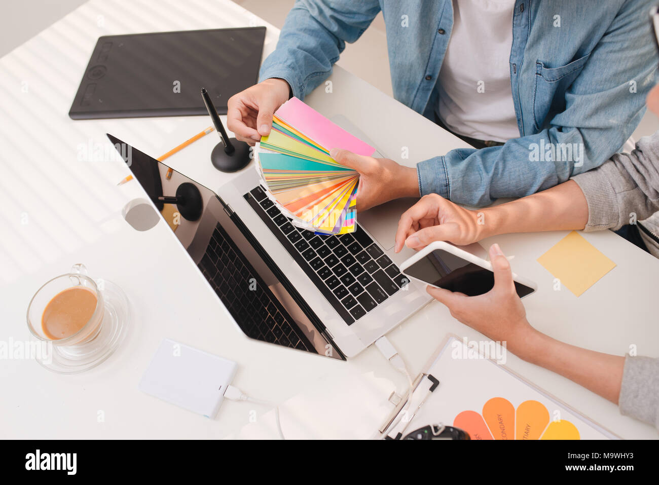 Coworking process, designers team working on computer in modern office ...