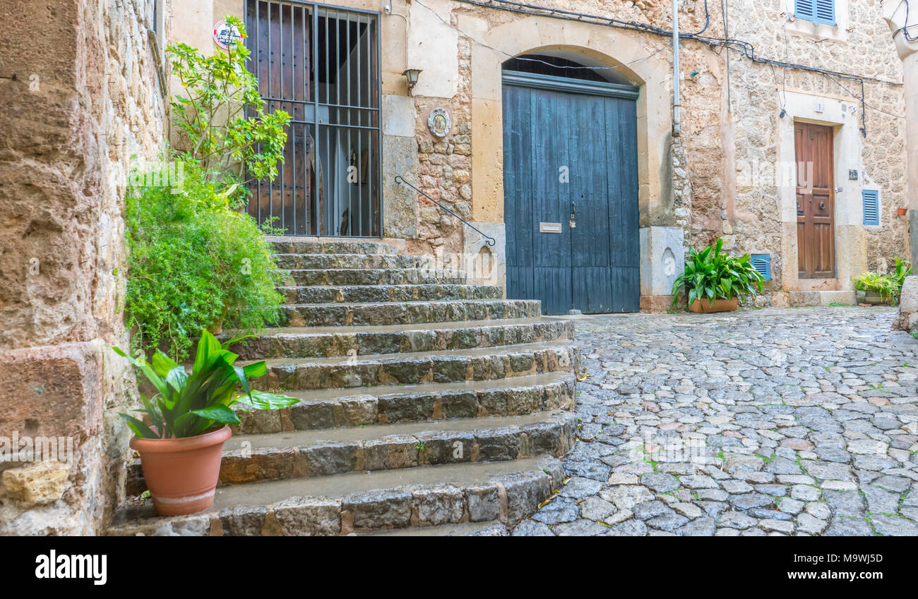 Beautiful street in Valldemossa with traditional flower decoration ...