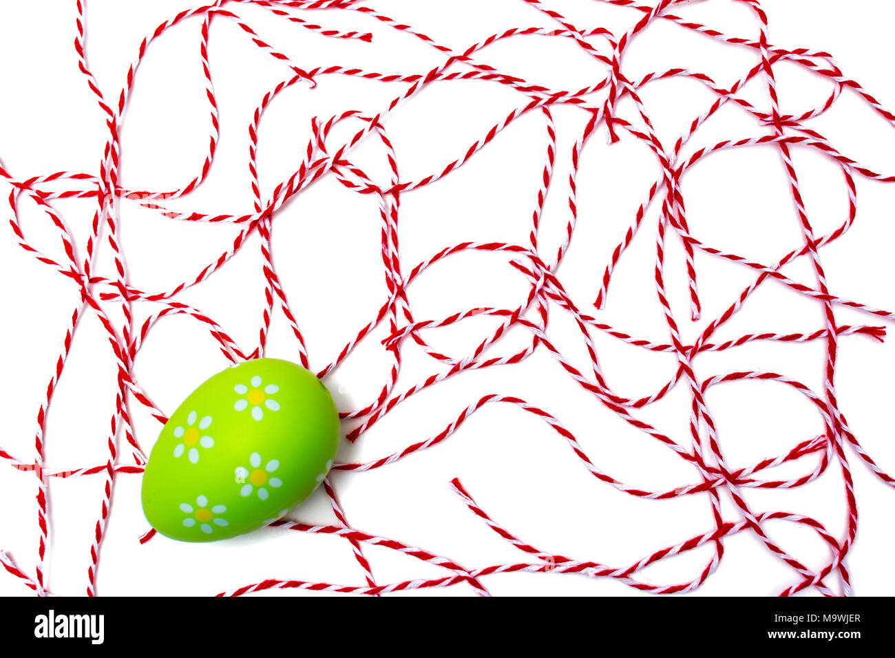 Colored Easter egg with white and red cord background march symbol ...