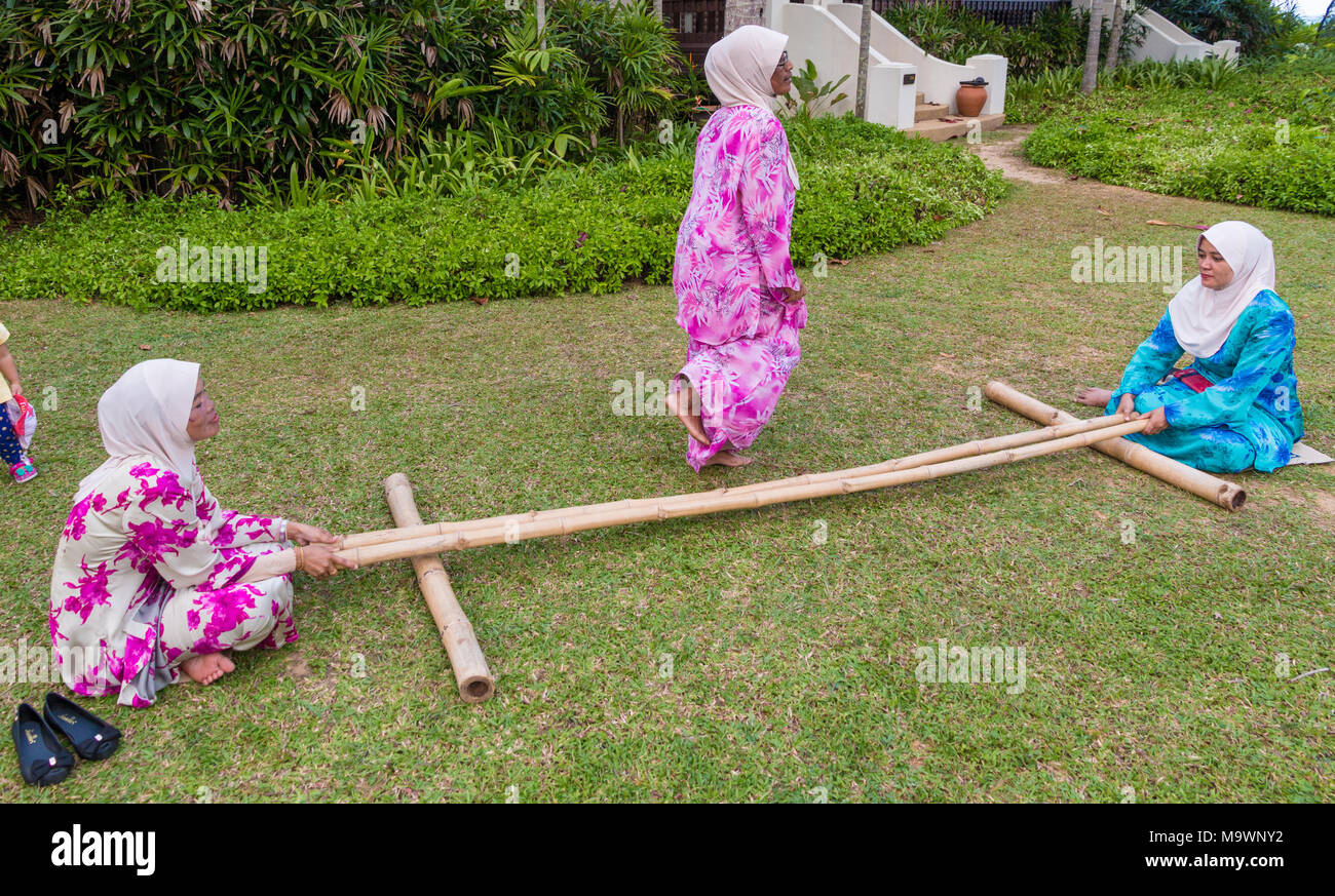 The Magunatip, a popular traditional "Bamboo Dance" in Sabah, Malaysia ...