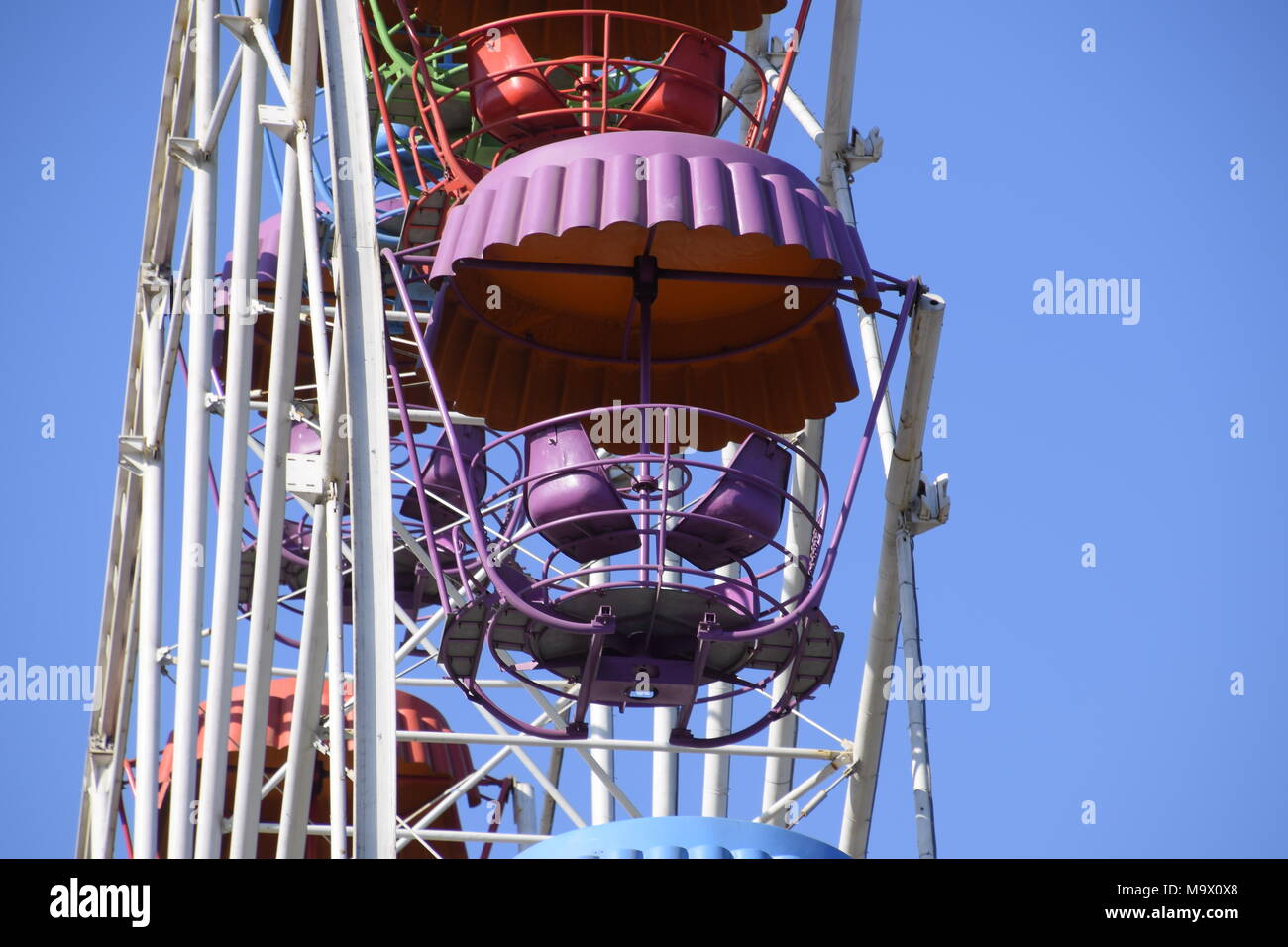 Ferris wheel. Ferris wheel in the city park. Seats for passengers on ...