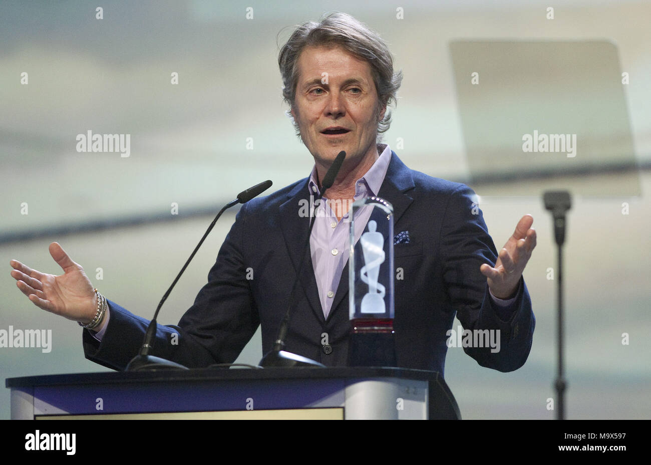 Vancouver, BRITISH COLUMBIA, CANADA. 24th Mar, 2018. Jim Cuddy receives ...