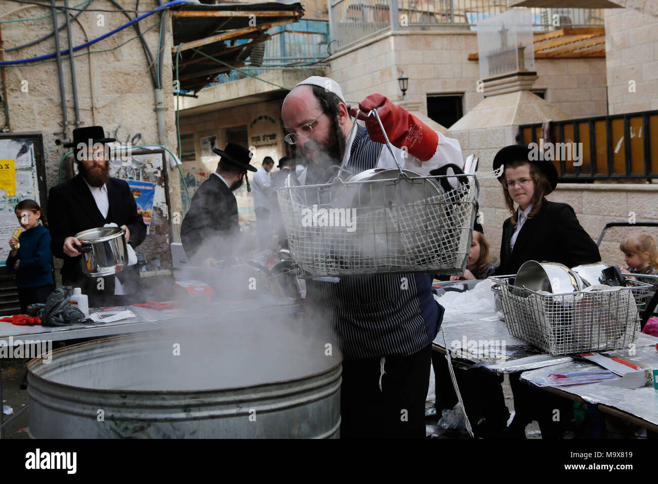 Jerusalem. 28th Mar, 2018. An ultra-Orthodox Jewish man dips his ...