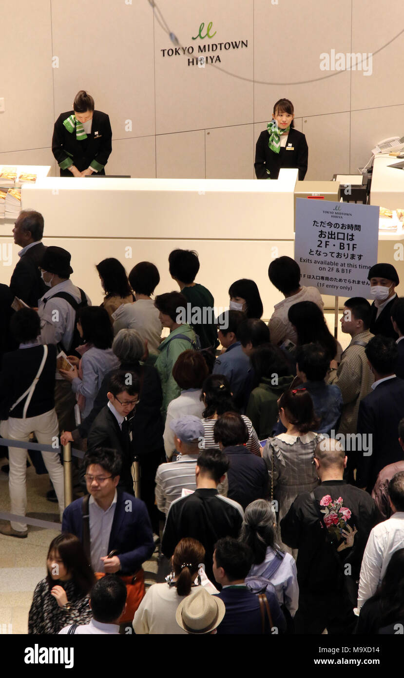 Tokyo, Japan. 29th Mar, 2018. People queue for shopping as the new ...