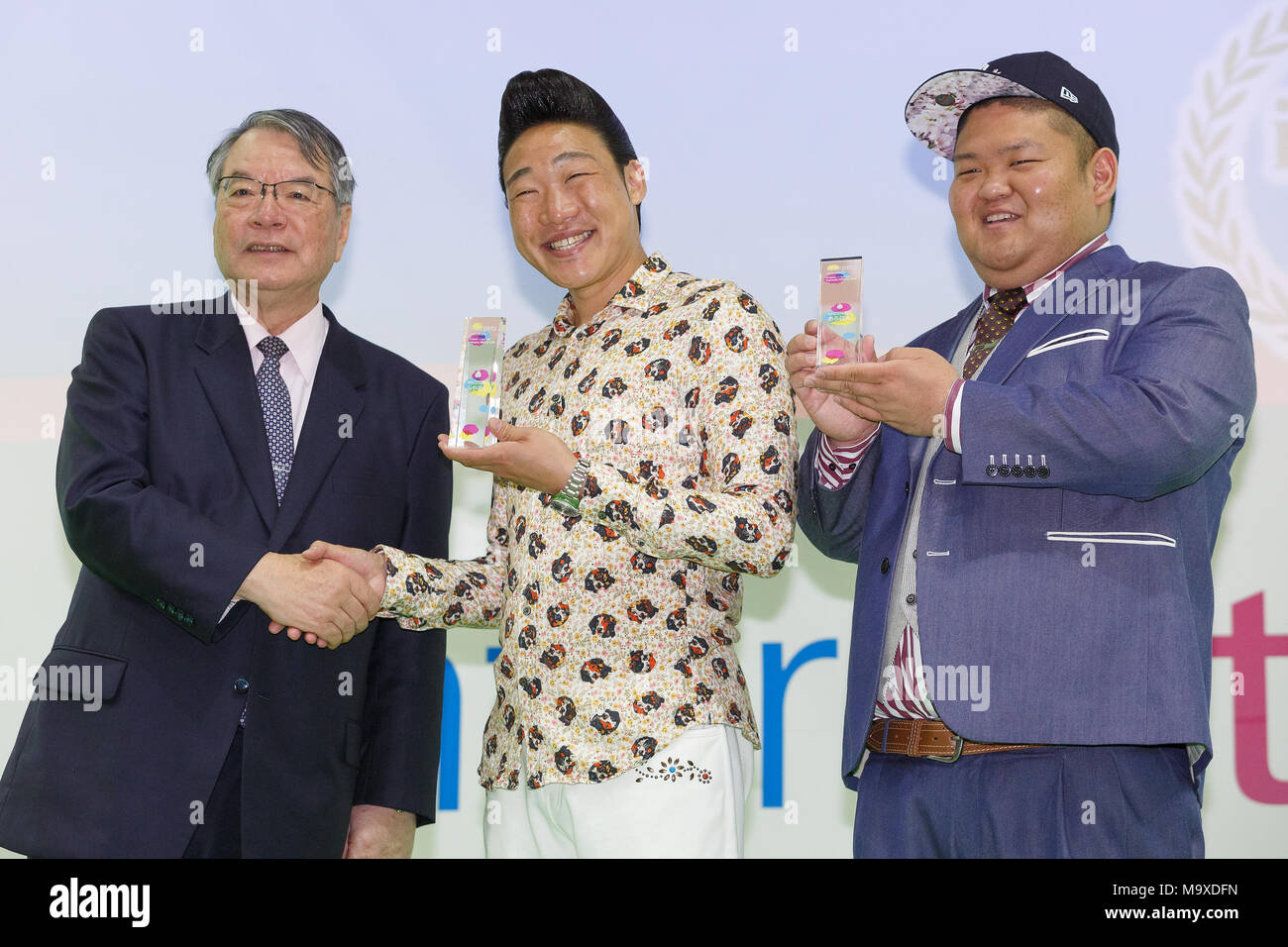 Japanese comedians Miyazon (C) and Arapon (R) of ANZEN manzai comic duo ...