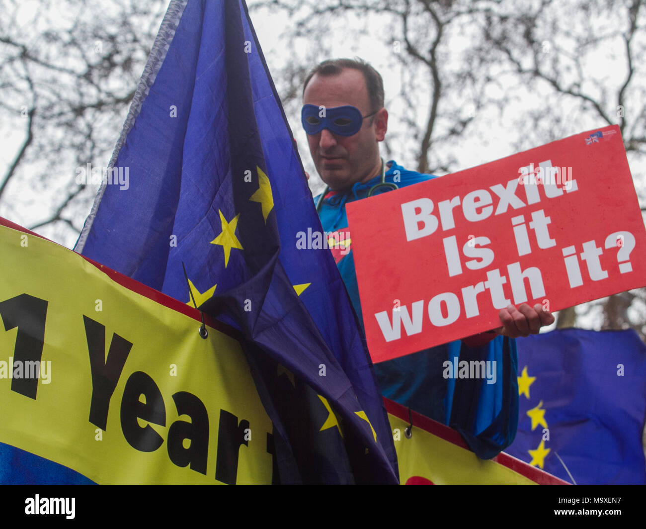 London, UK. 29th March 2018. A protester holds a placard "Brexit Is it ...