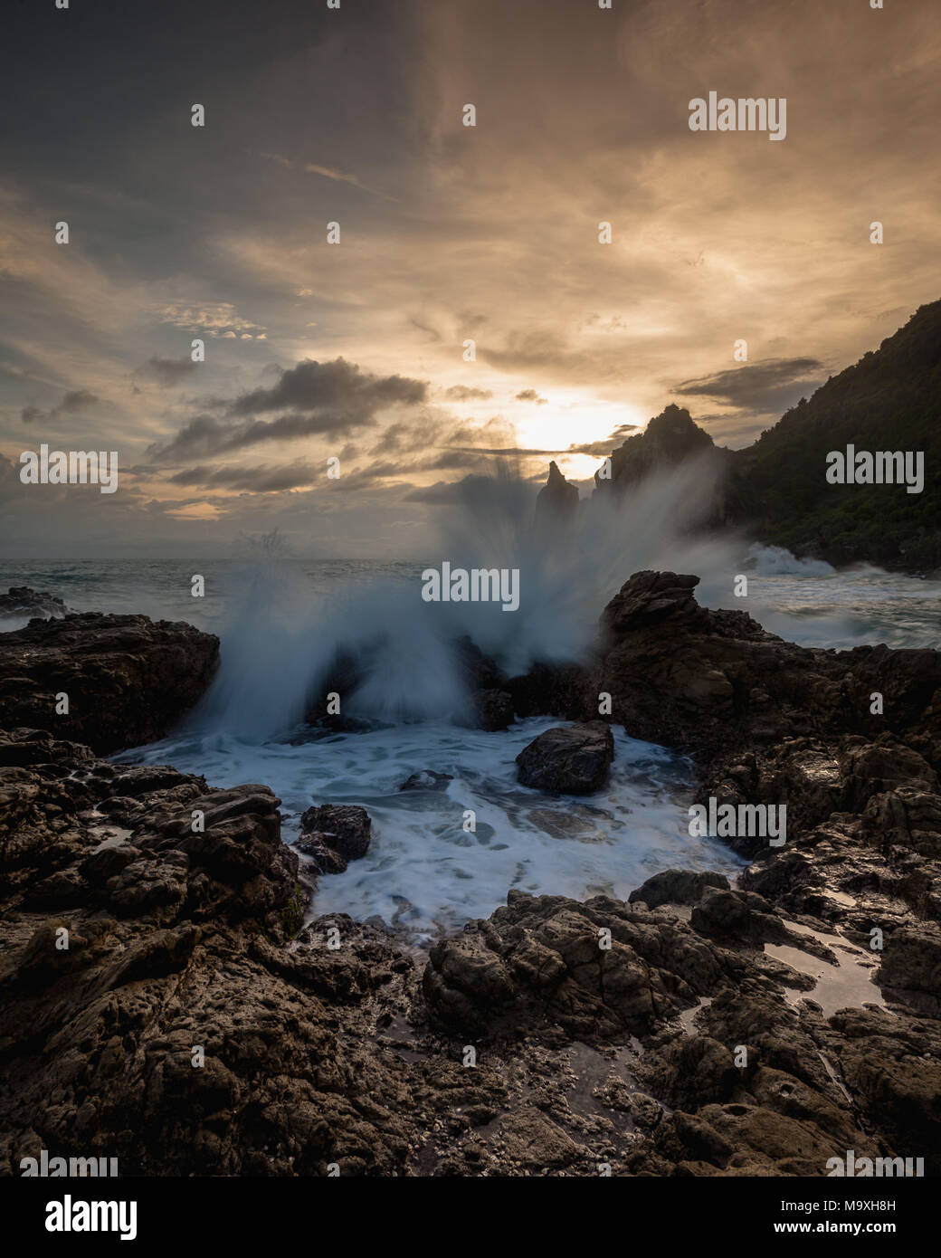 dramatic sunset at karang bolong beach. one of the most beautiful beach ...