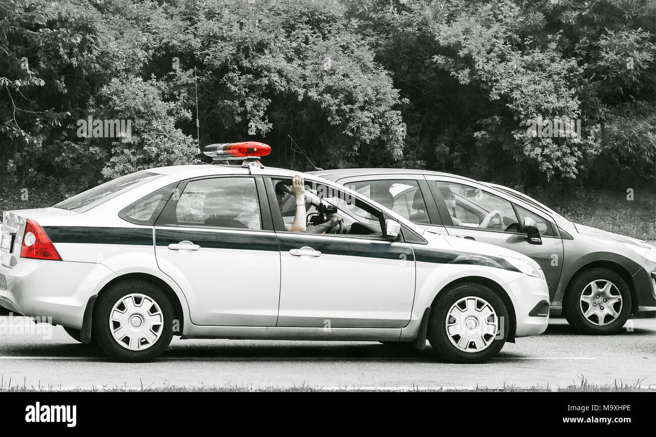 police car patrols on the town road Stock Photo - Alamy