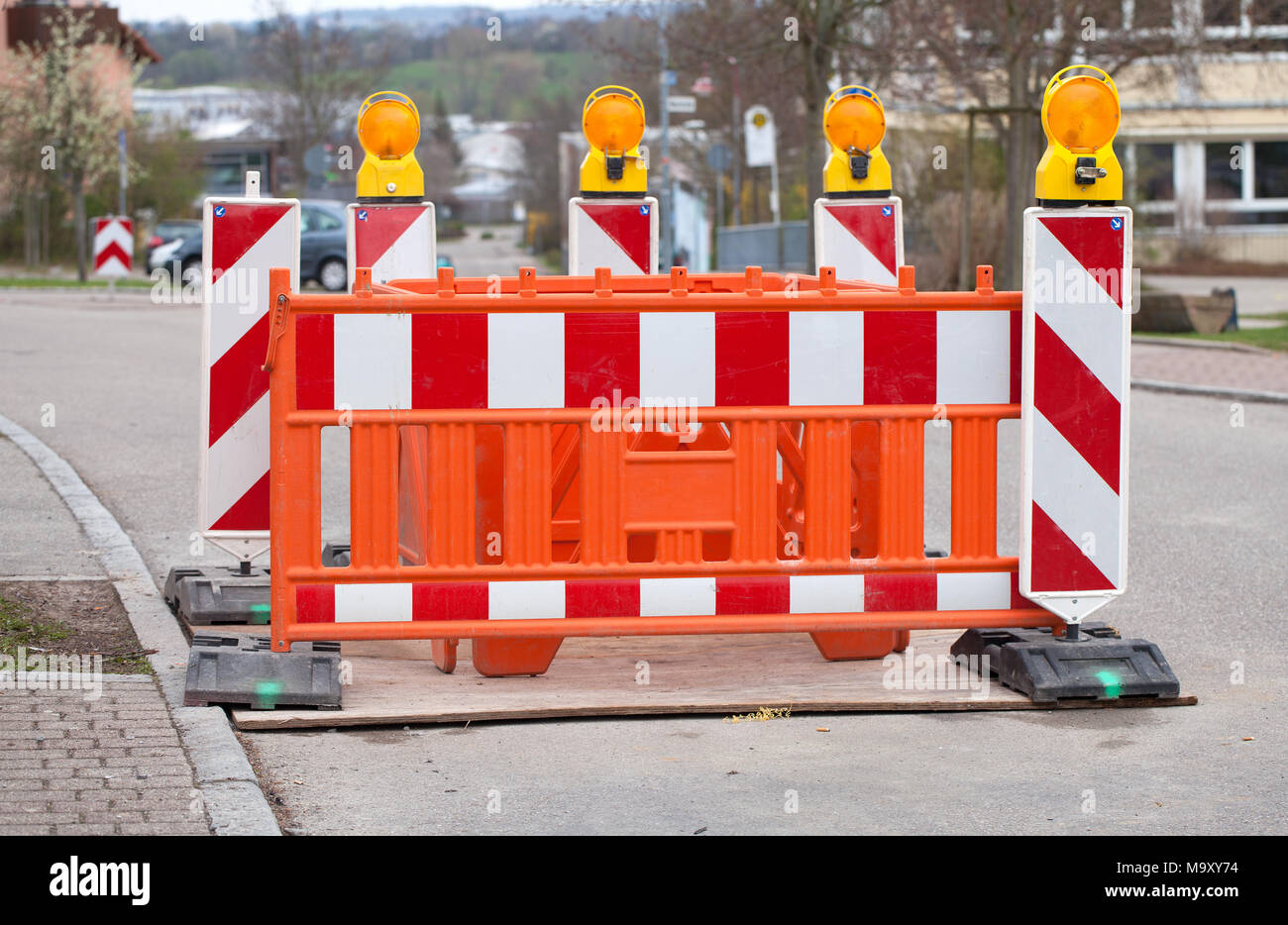 Barrier with warning lights at construction site Stock Photo - Alamy