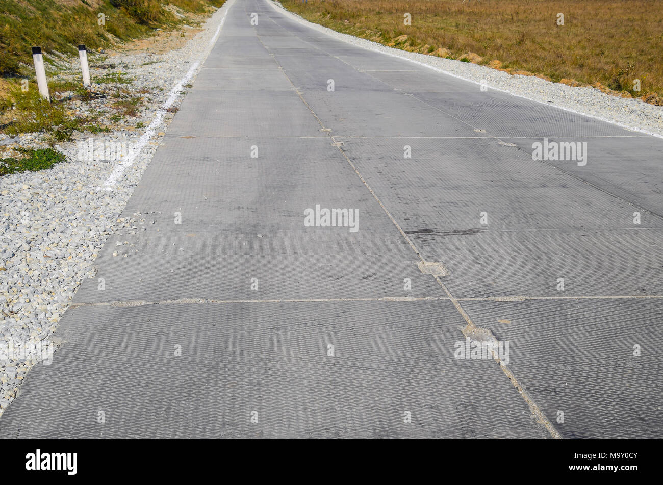 Road from concrete slabs. Reinforced concrete slabs on the road. Road ...