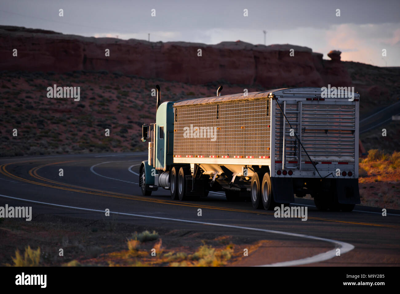 Big rig American classic semi truck with compact bulk covered protected ...