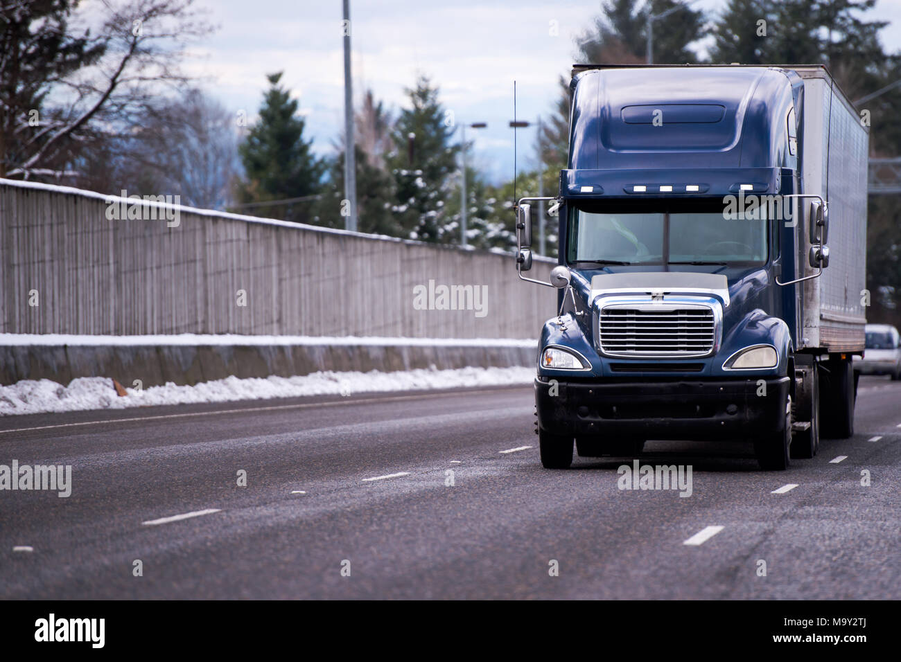Dark blue big rig semi truck fleet with shiny chrome details and dry ...