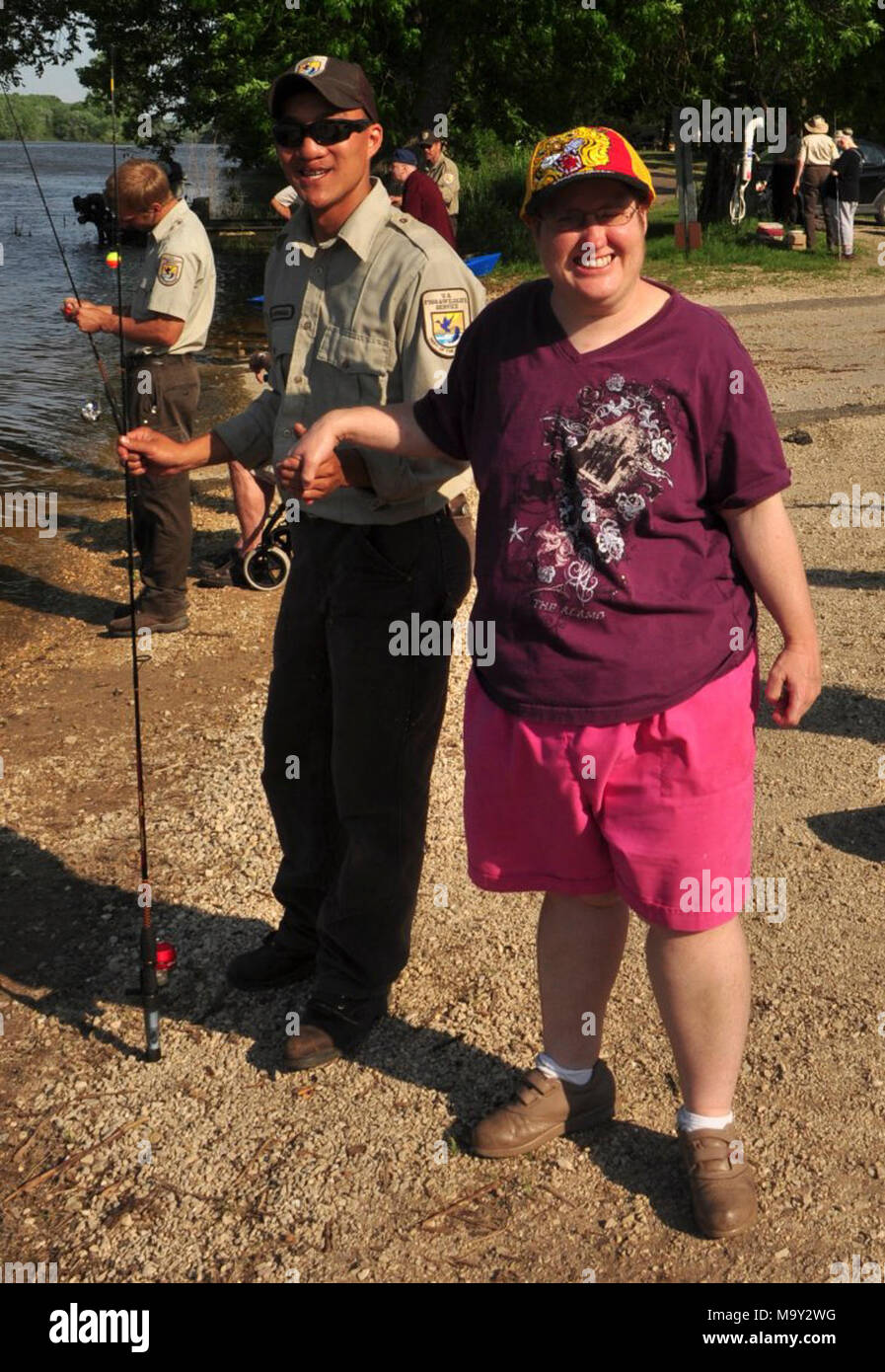 MW Mark Spitznogle helps a Project COMPASS participant to the. MW Mark ...