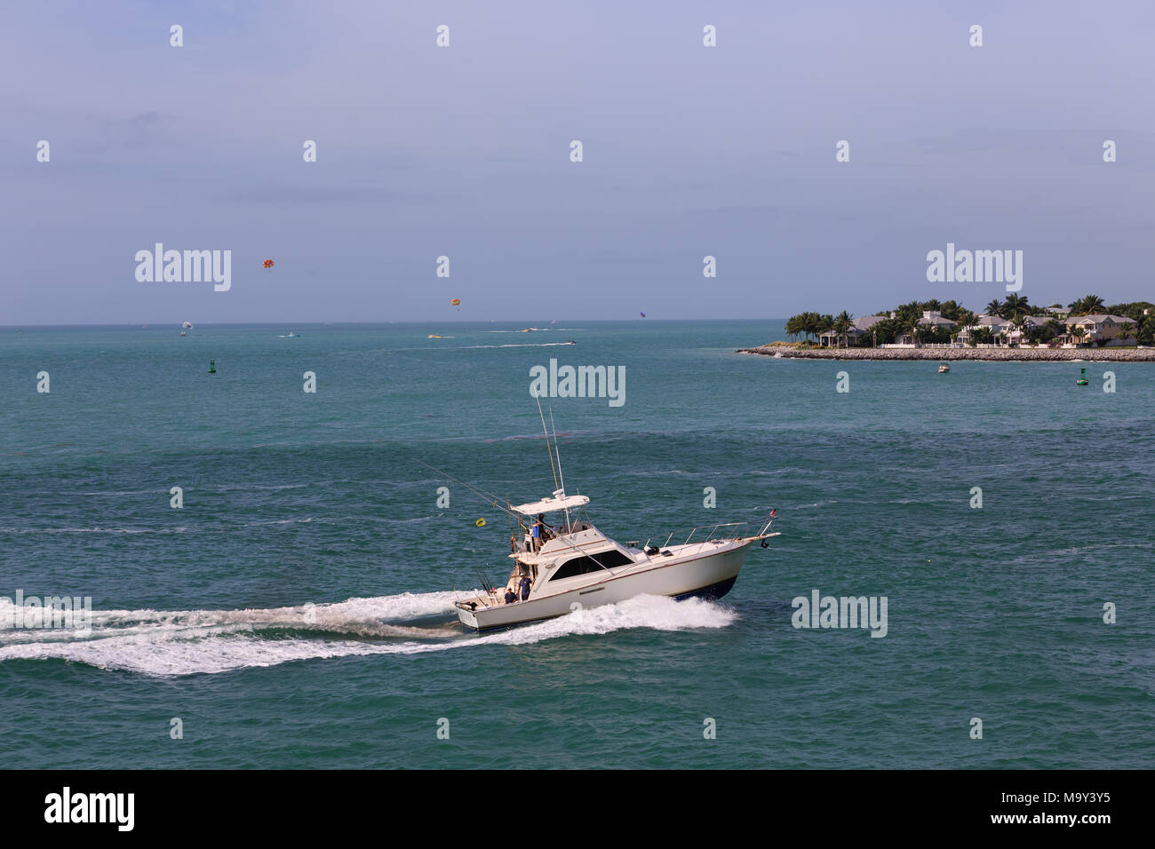 Fishing Boat Past Sunset Key Stock Photo - Alamy
