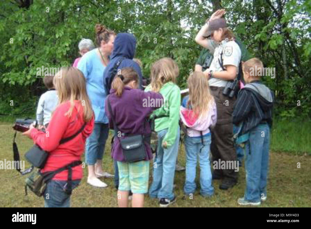Kara Zwickey Leading Birding Activity. Eager students gather around ...