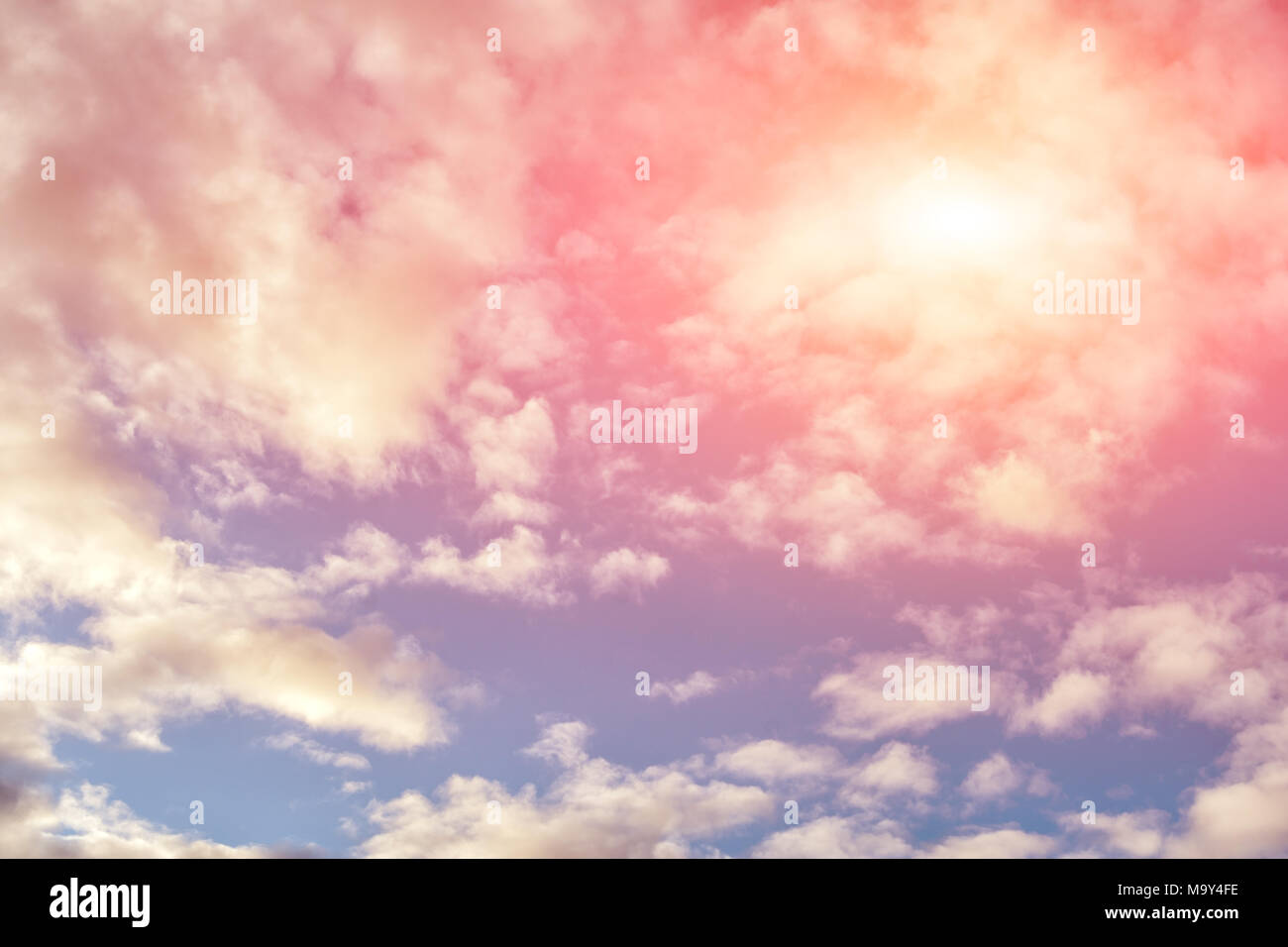 texture bright contrast sky with clouds and sun rays Stock Photo - Alamy