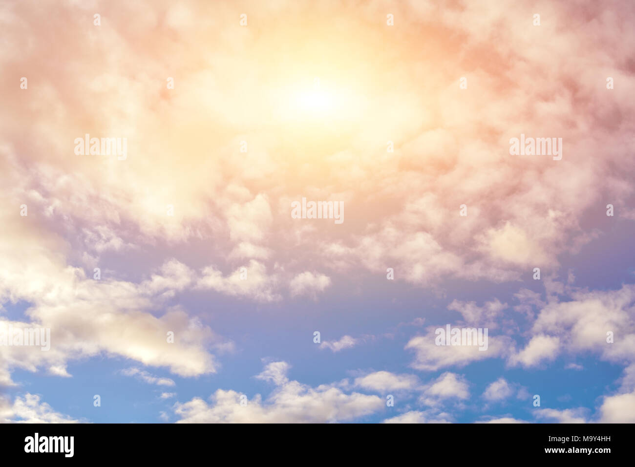 texture of the sky clouds and rays of sun on a background of blue sky ...