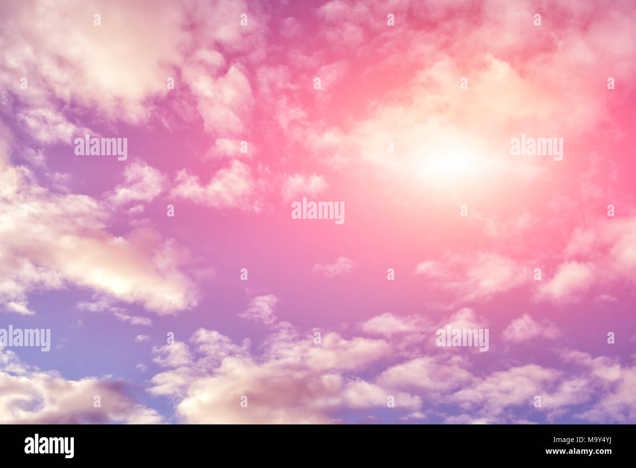 texture bright contrast sky with clouds and sun rays Stock Photo - Alamy