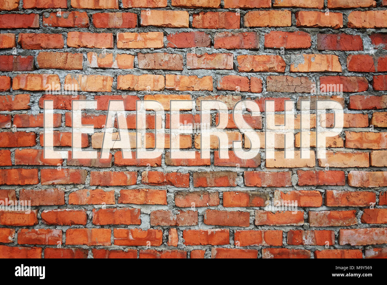 Leadership, business concept words, with red brick tiled walls as ...