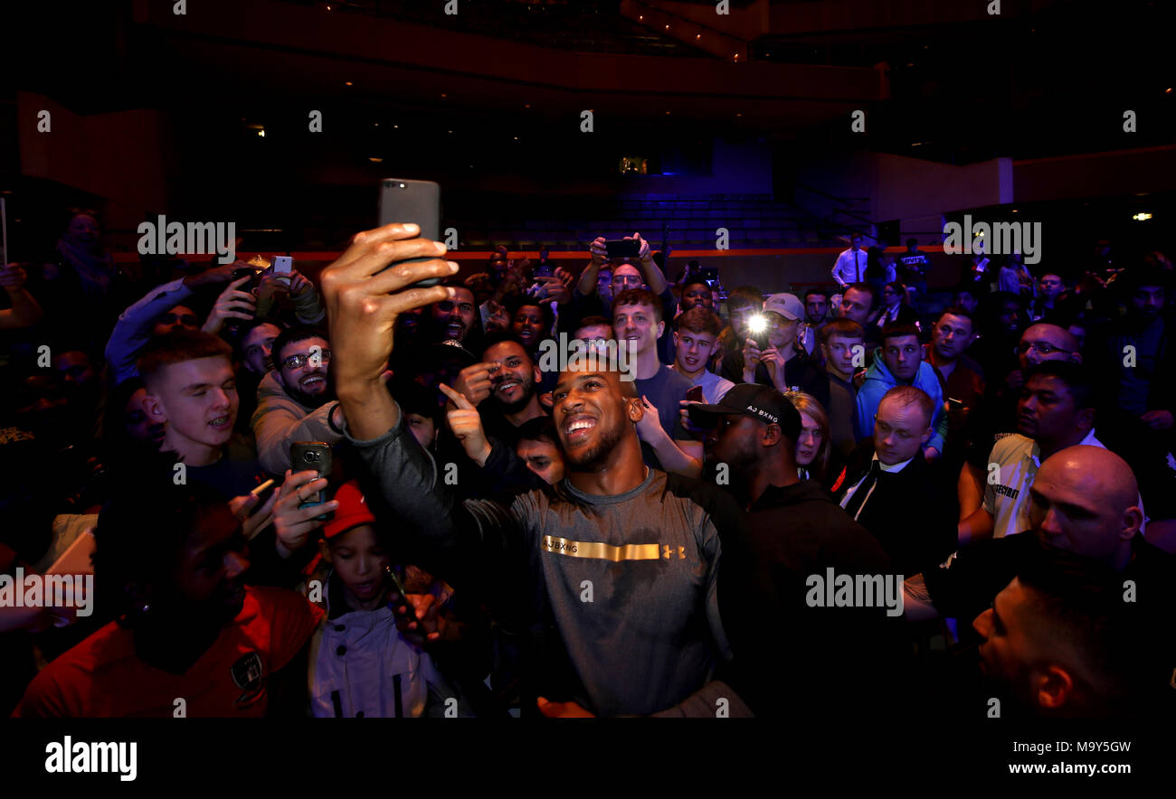 Anthony Joshua poses for photos with young boxing fans during the media ...