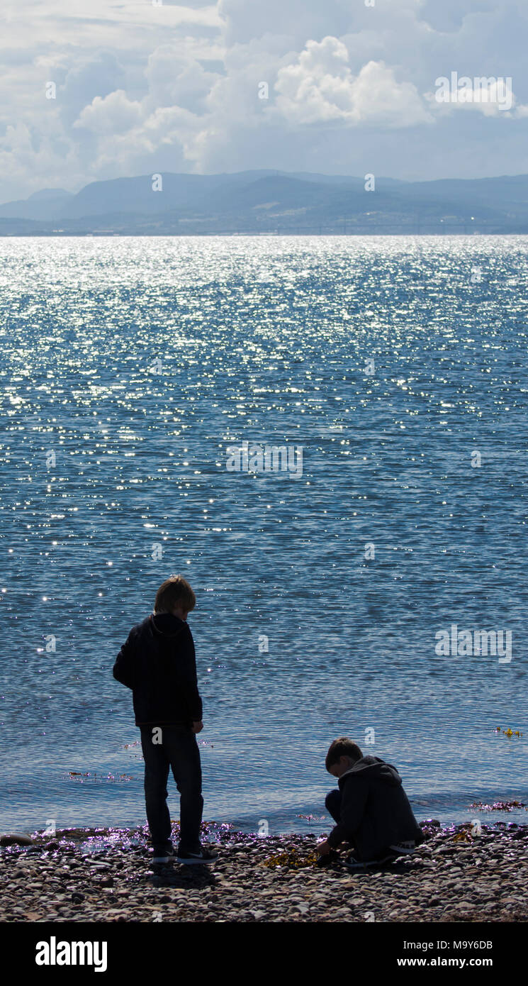 Two boys on beach, Chanonry Point, Fortrose Stock Photo - Alamy