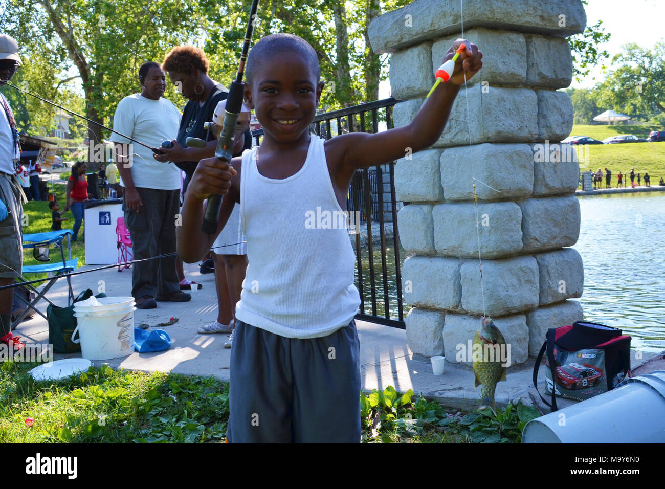 Boy with Fish. A young boy shows off his catch Stock Photo - Alamy