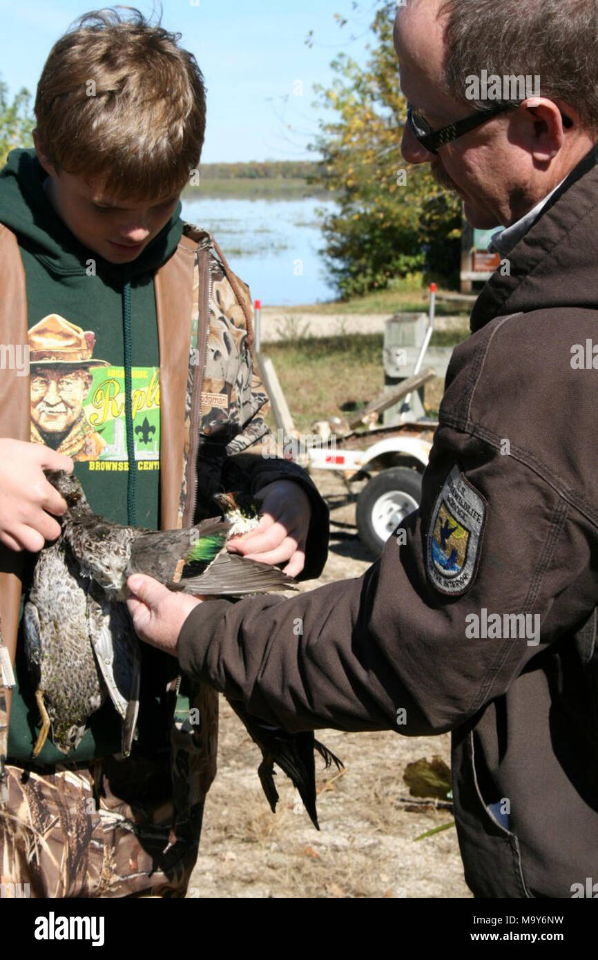 BP bagchecking AN at Weaver 2. Wildlife Refuge Specialists Pember shows ...