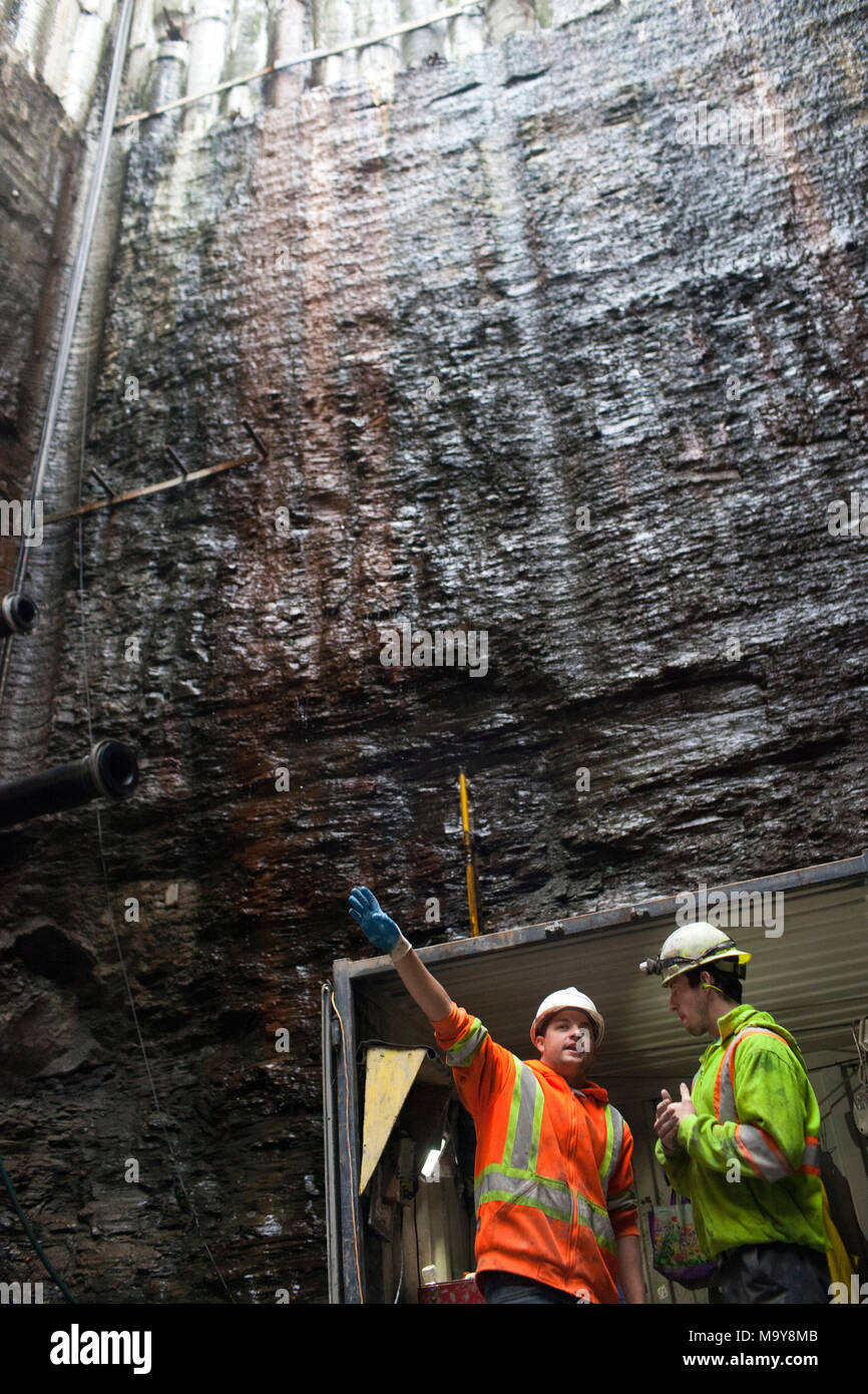 Employees of Technicore Underground construct an under-lake pedestrian ...