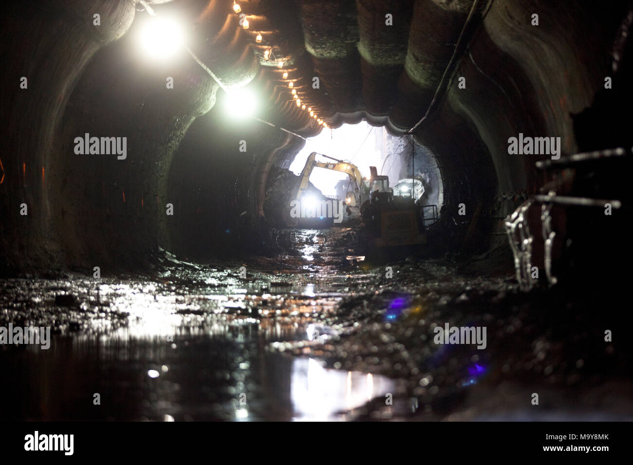 Employees of Technicore Underground construct an under-lake pedestrian ...