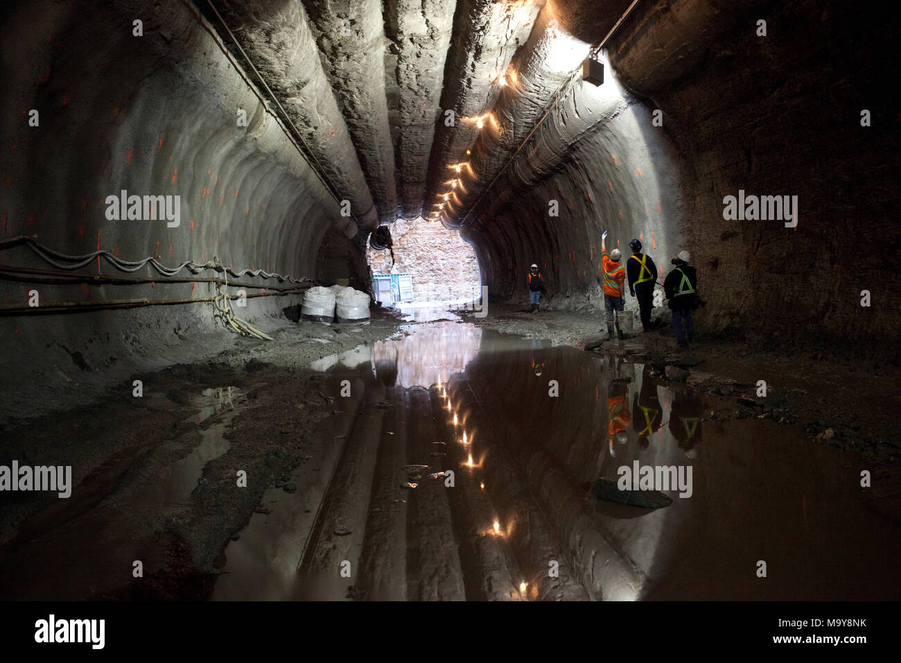 Employees of Technicore Underground construct an under-lake pedestrian ...
