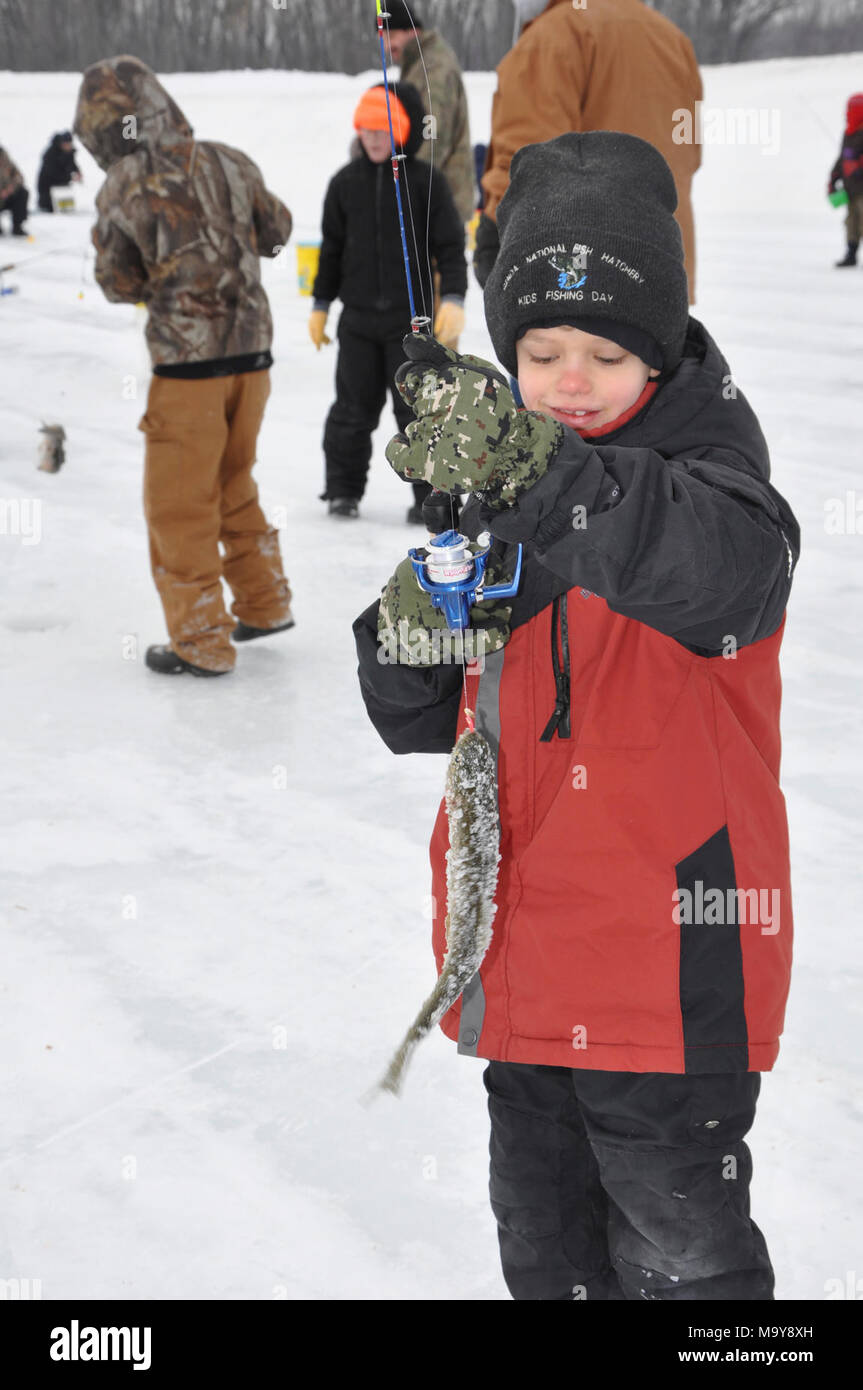 Kids ice fishing competition Stock Photo - Alamy